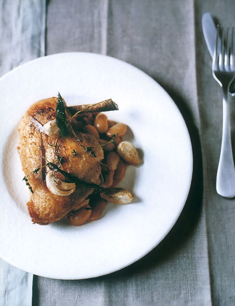 Confit chicken legs with chorizo bean stew and roasted garlic from ...