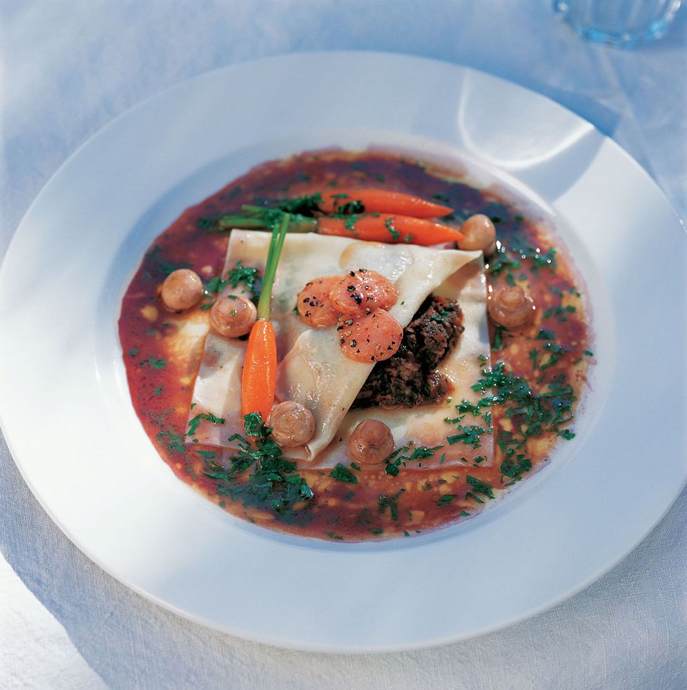 Braised oxtail ravioli with poached bone marrow and baby carrots from ...